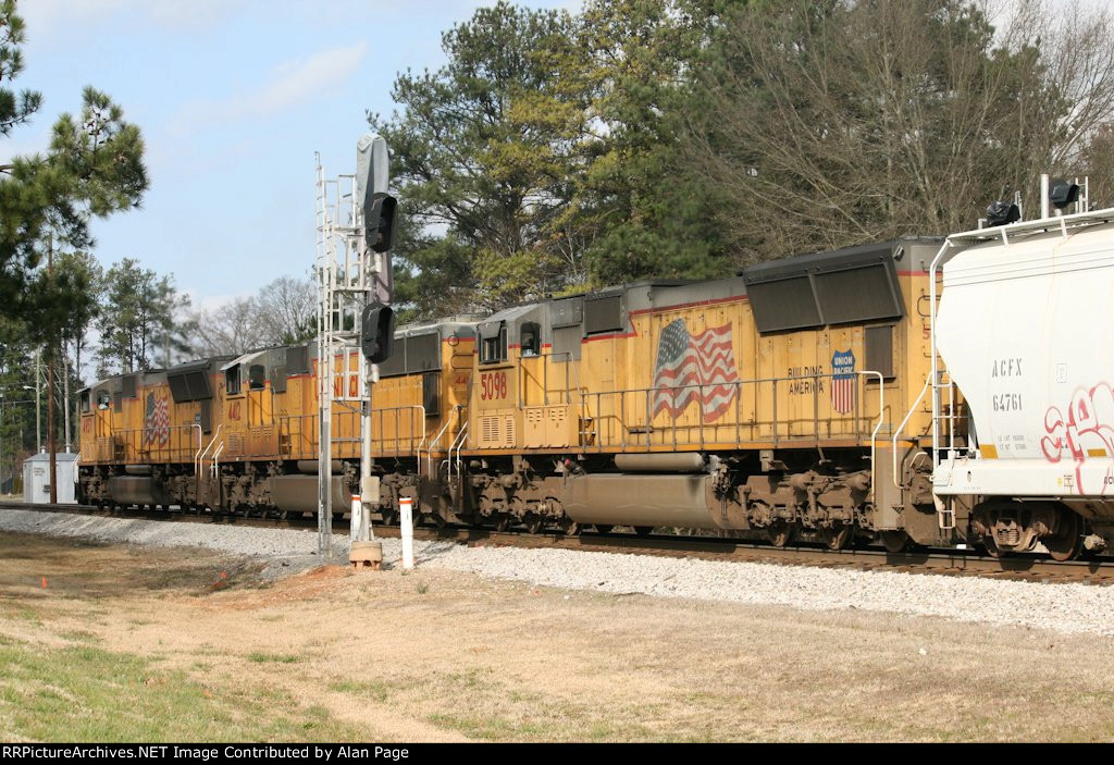 UP SD70Ms 4957, 4412, and 5098 head east past the Dodson Road signals